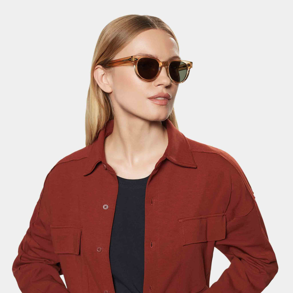 Round champagne-colored sustainable sunglasses: Palm | TBD Eyewear